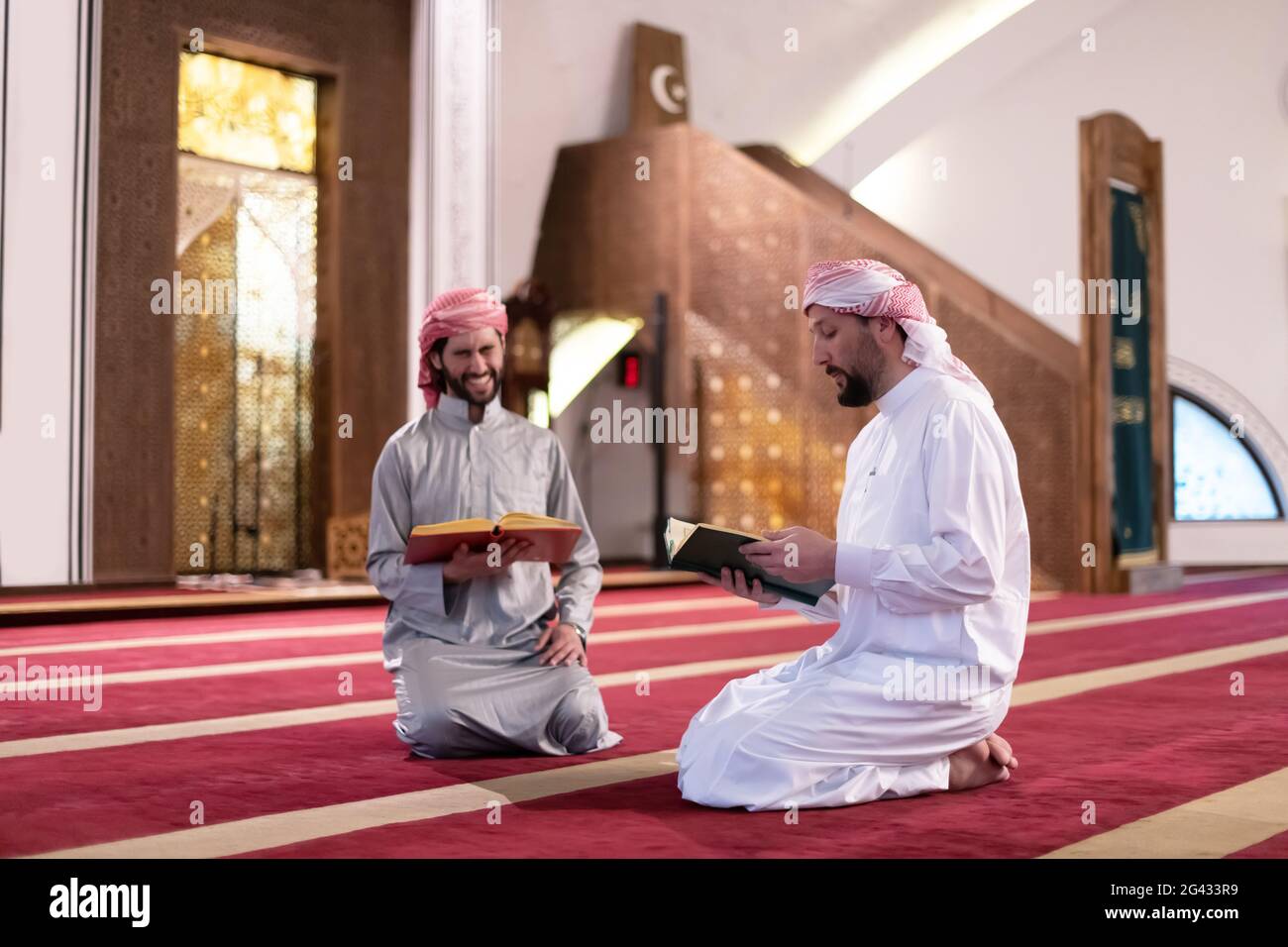 Two muslim people in mosque reading quran together concept of islamic ...