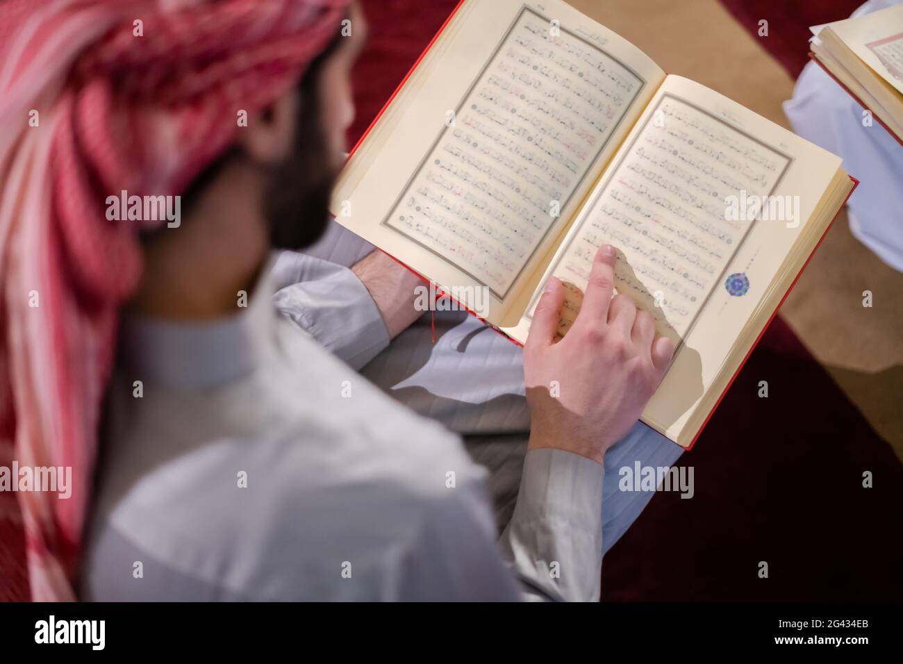 Two muslim people in mosque reading quran together concept of islamic ...