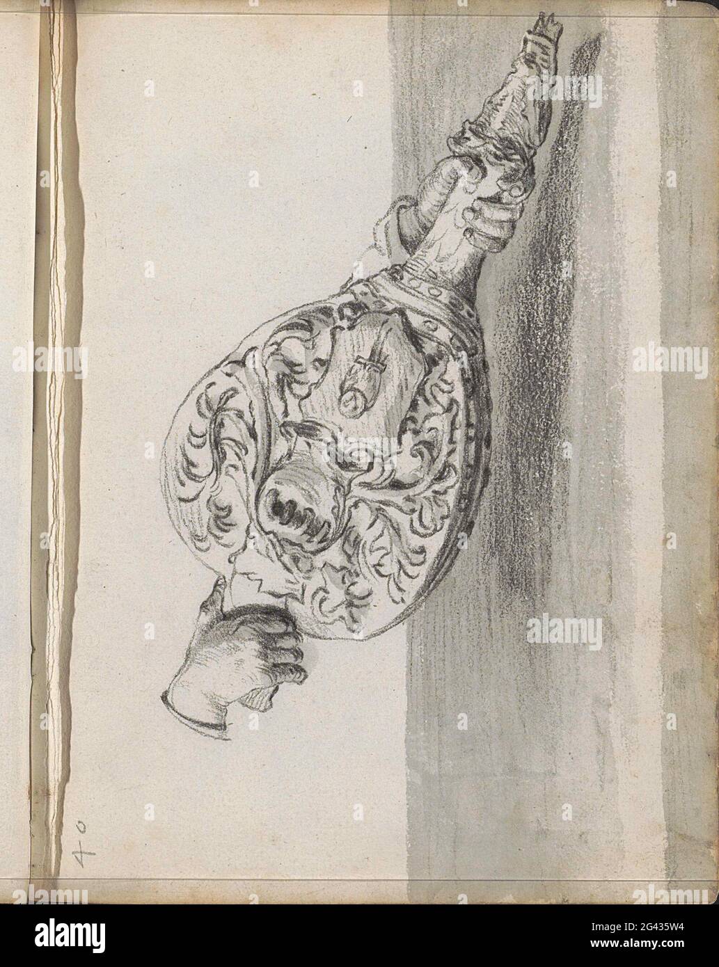 Bellows. Block bellows retained by a hand decorated with leaf motifs ...