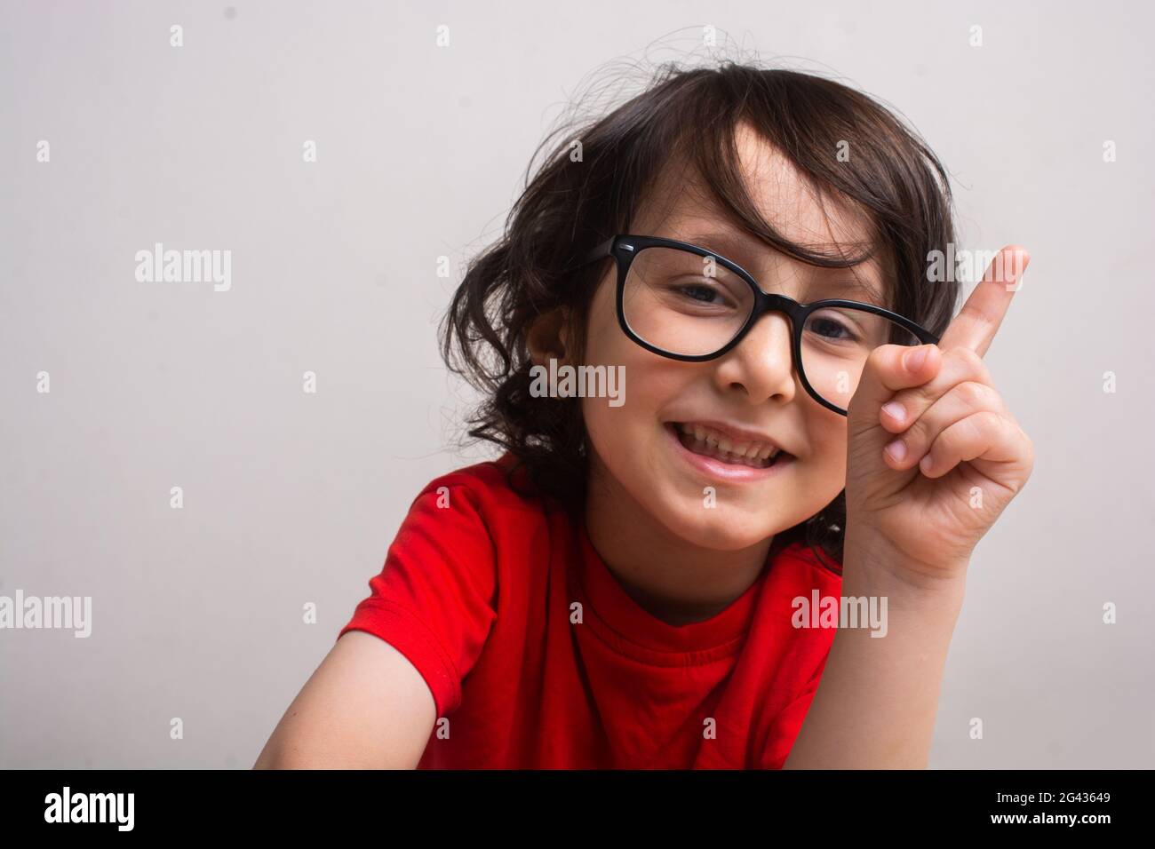Child raising hand hi-res stock photography and images - Alamy