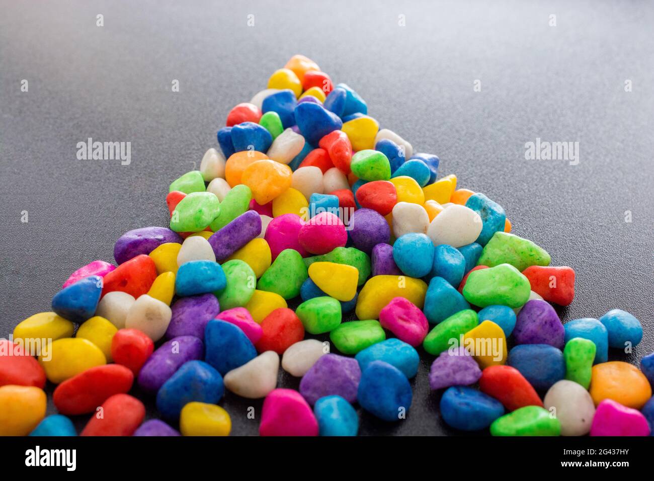 Pile of colorful pebbles as a stone background Stock Photo - Alamy