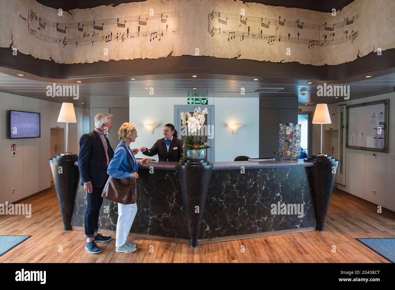 Couple at the reception of the river cruise ship during a cruise on the ...