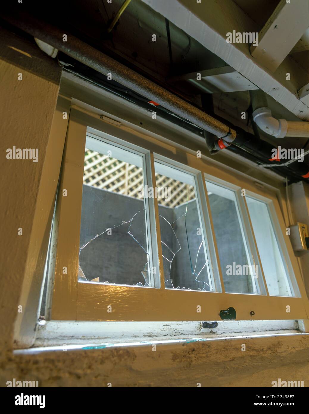 BROKEN WINDOW PANES OF FRAME OF OPEN BASEMENT WINDOW Stock Photo - Alamy