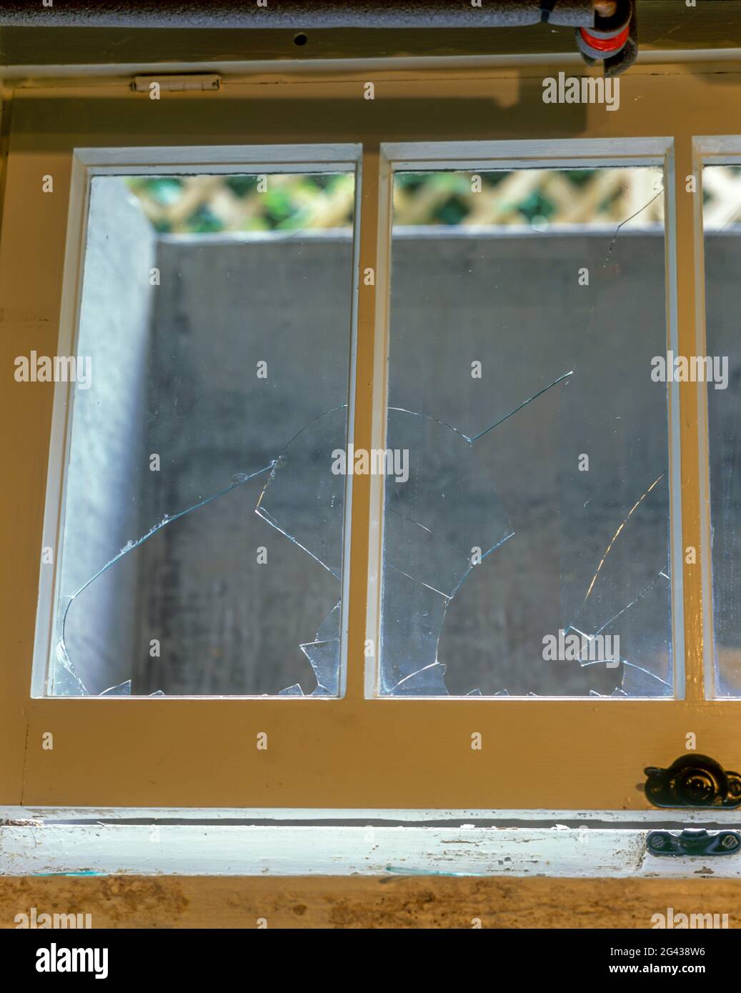 BROKEN WINDOW PANES OF FRAME OF OPEN BASEMENT WINDOW Stock Photo - Alamy