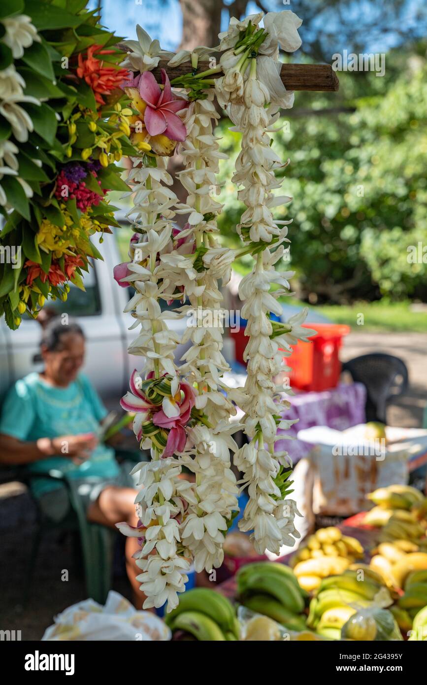 Flower wreaths for sale at roadside market stall, Moorea, Windward ...