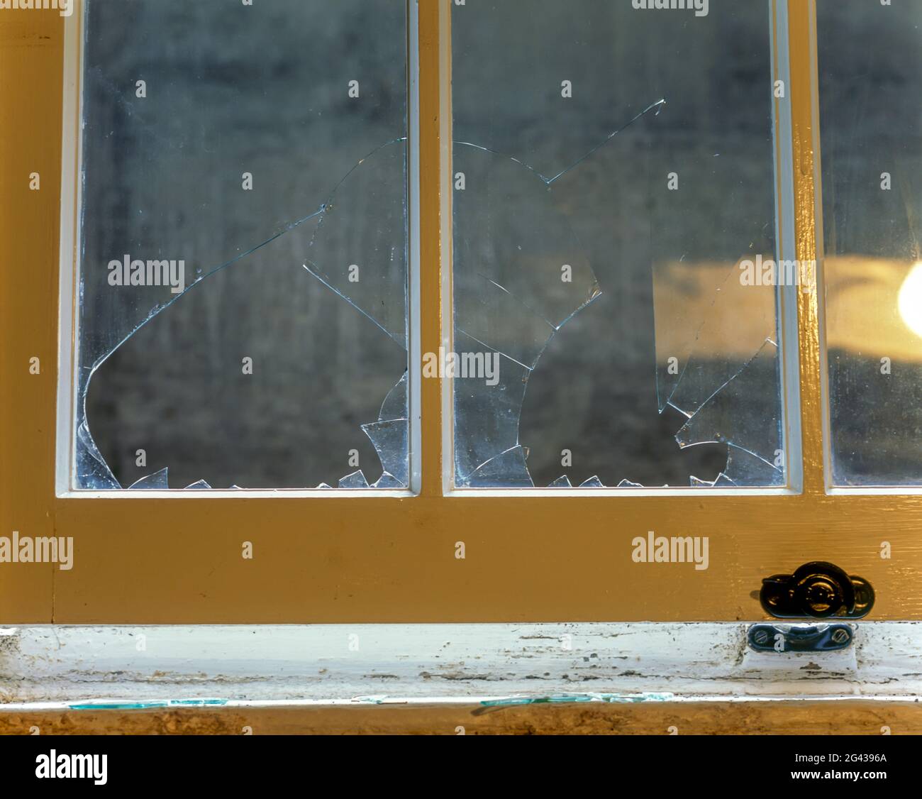 BROKEN WINDOW PANES OF FRAME OF OPEN BASEMENT WINDOW Stock Photo - Alamy