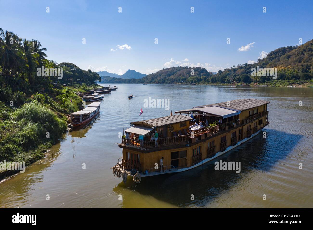 Aerial view of river cruise ship Mekong Sun and local excursion boats ...