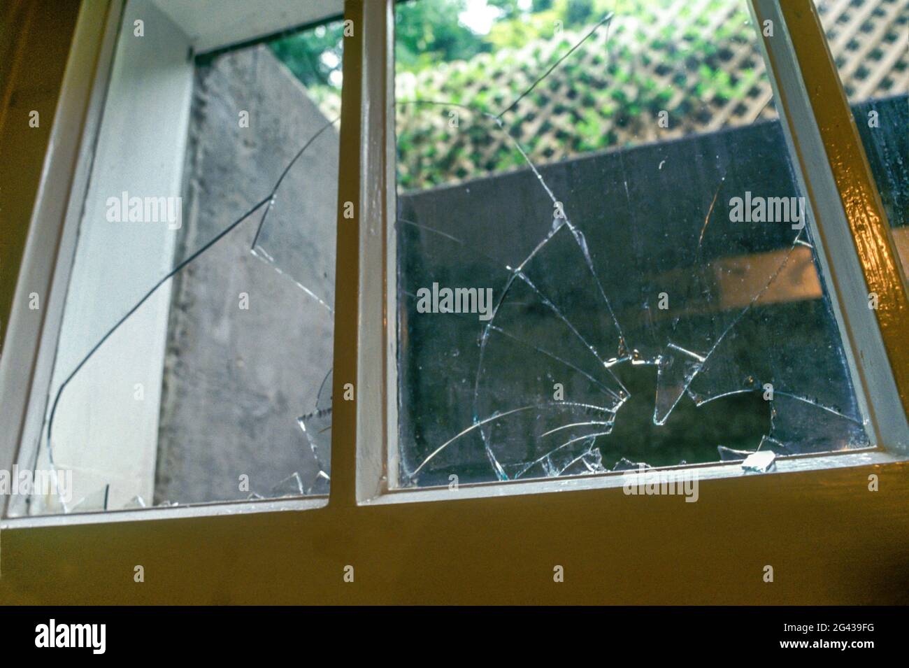 BROKEN WINDOW PANES OF FRAME OF OPEN BASEMENT WINDOW Stock Photo - Alamy