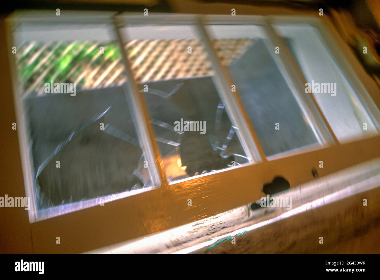 BROKEN WINDOW PANES OF FRAME OF OPEN BASEMENT WINDOW Stock Photo - Alamy