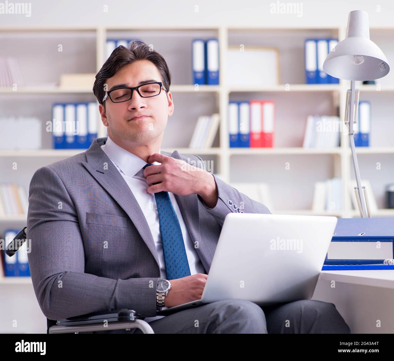 Disabled businessman working in the office Stock Photo - Alamy
