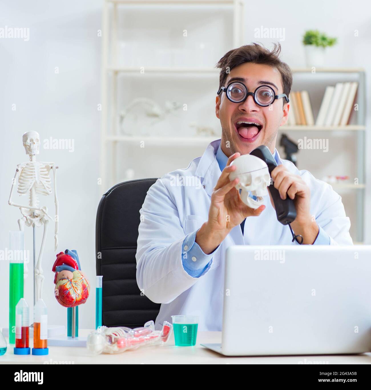 Funny doctor having fun in hospital lab Stock Photo - Alamy