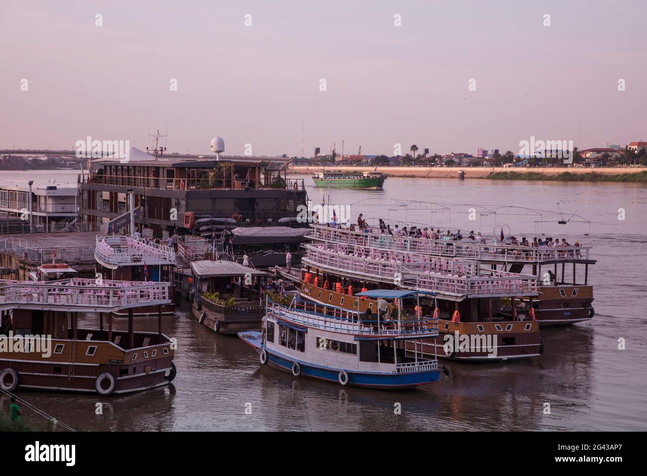 river cruise ship and tour boats moored at Phnom Penh floating port at ...