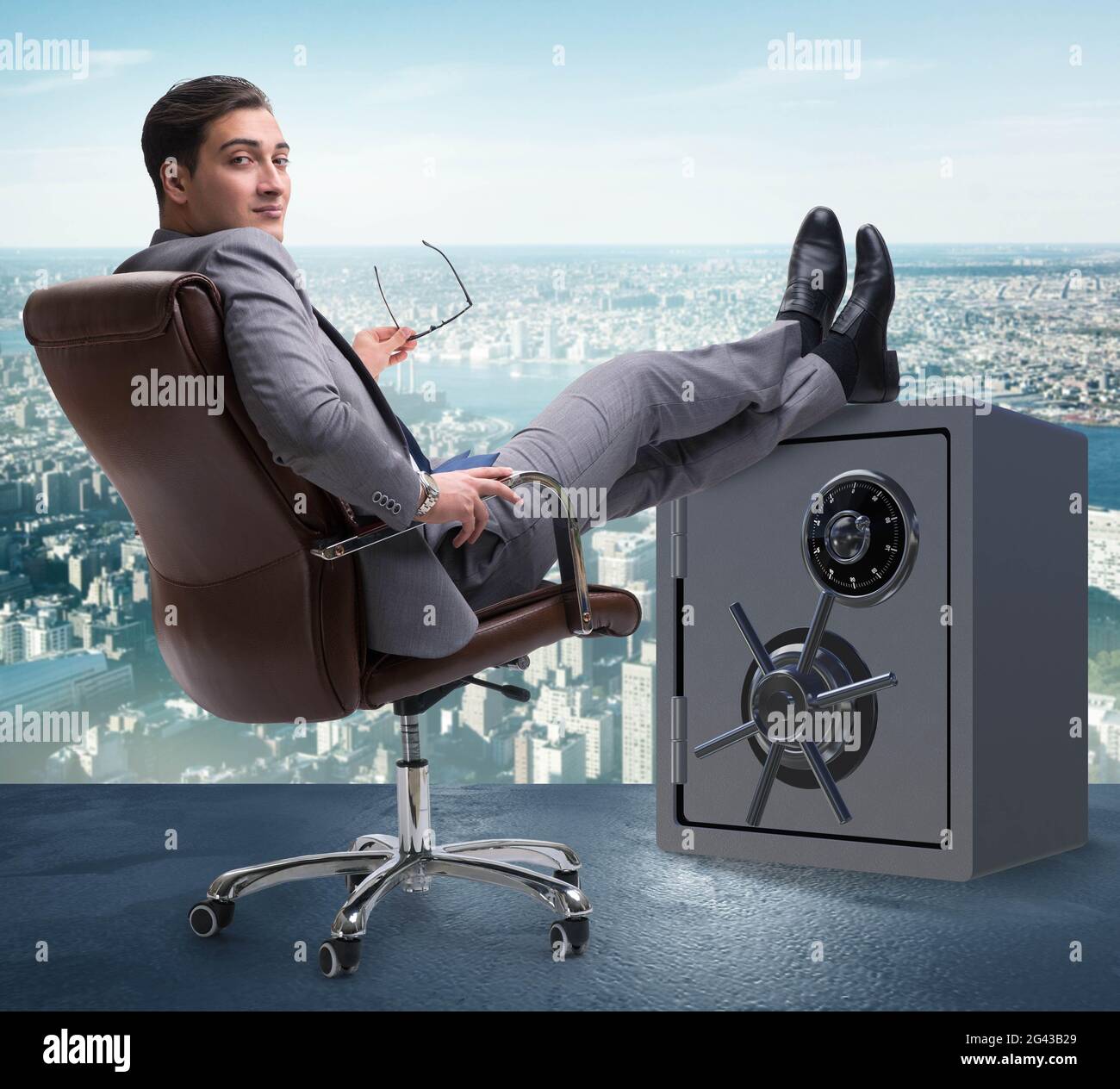 Businessman resting putting leg on safe Stock Photo - Alamy