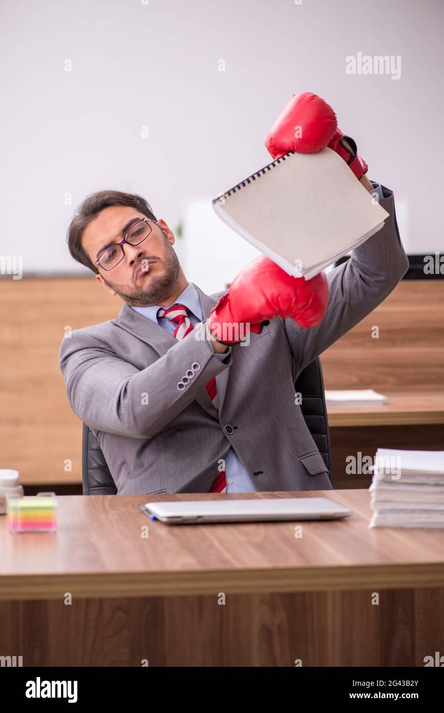 Stressed manager boxing gloves punching hi-res stock photography and ...