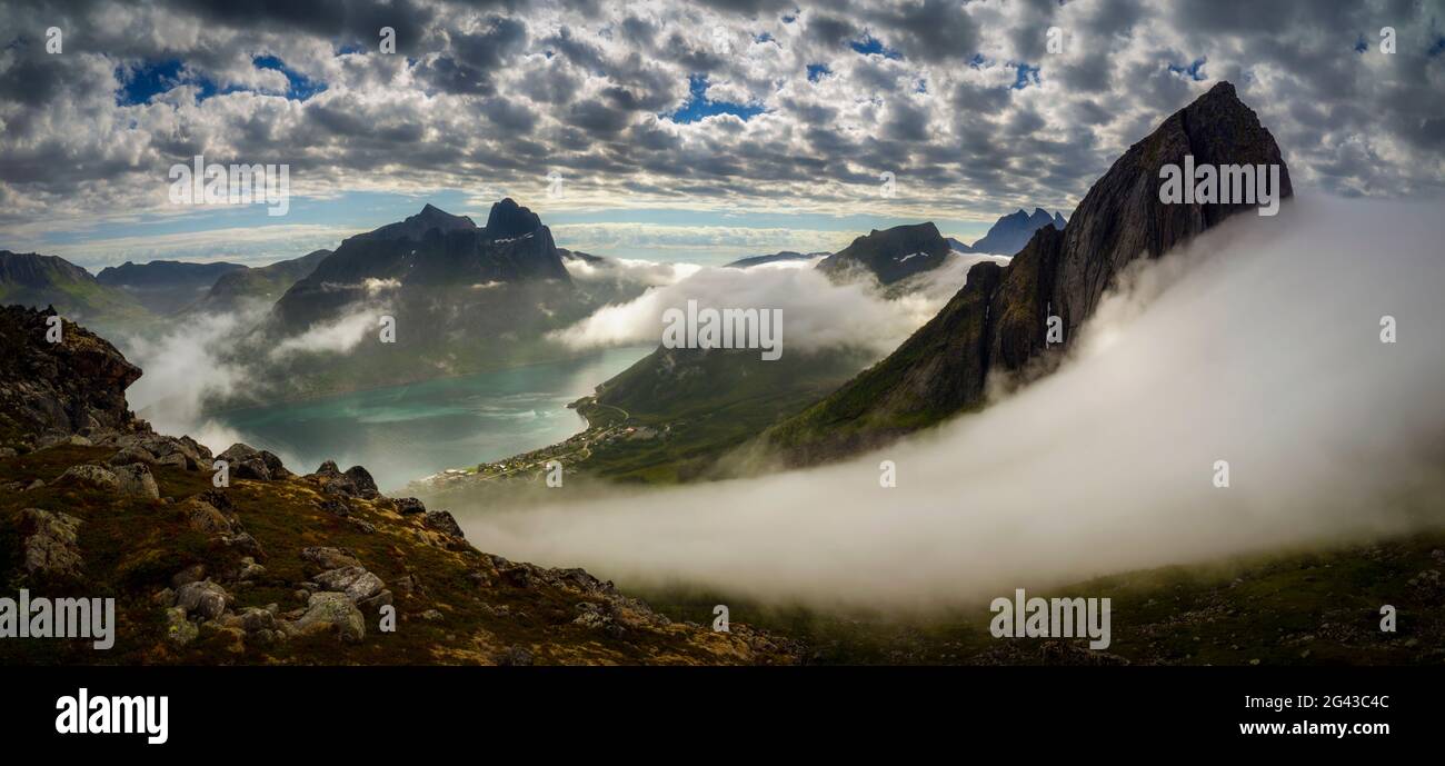 Segla peak in fog and Fjordgard village, Senja, Norway Stock Photo - Alamy