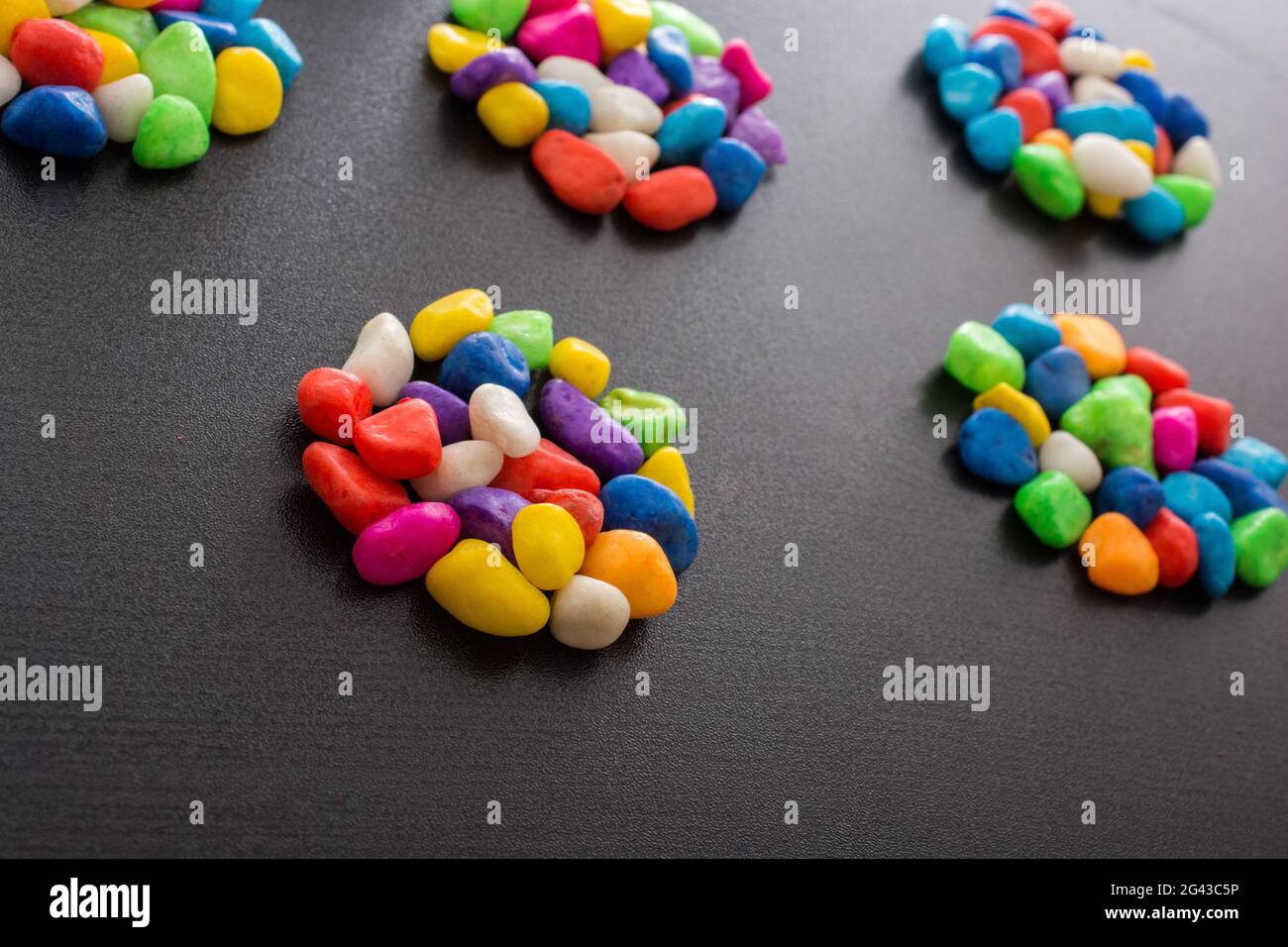 Pile of colorful pebbles as a stone background Stock Photo - Alamy