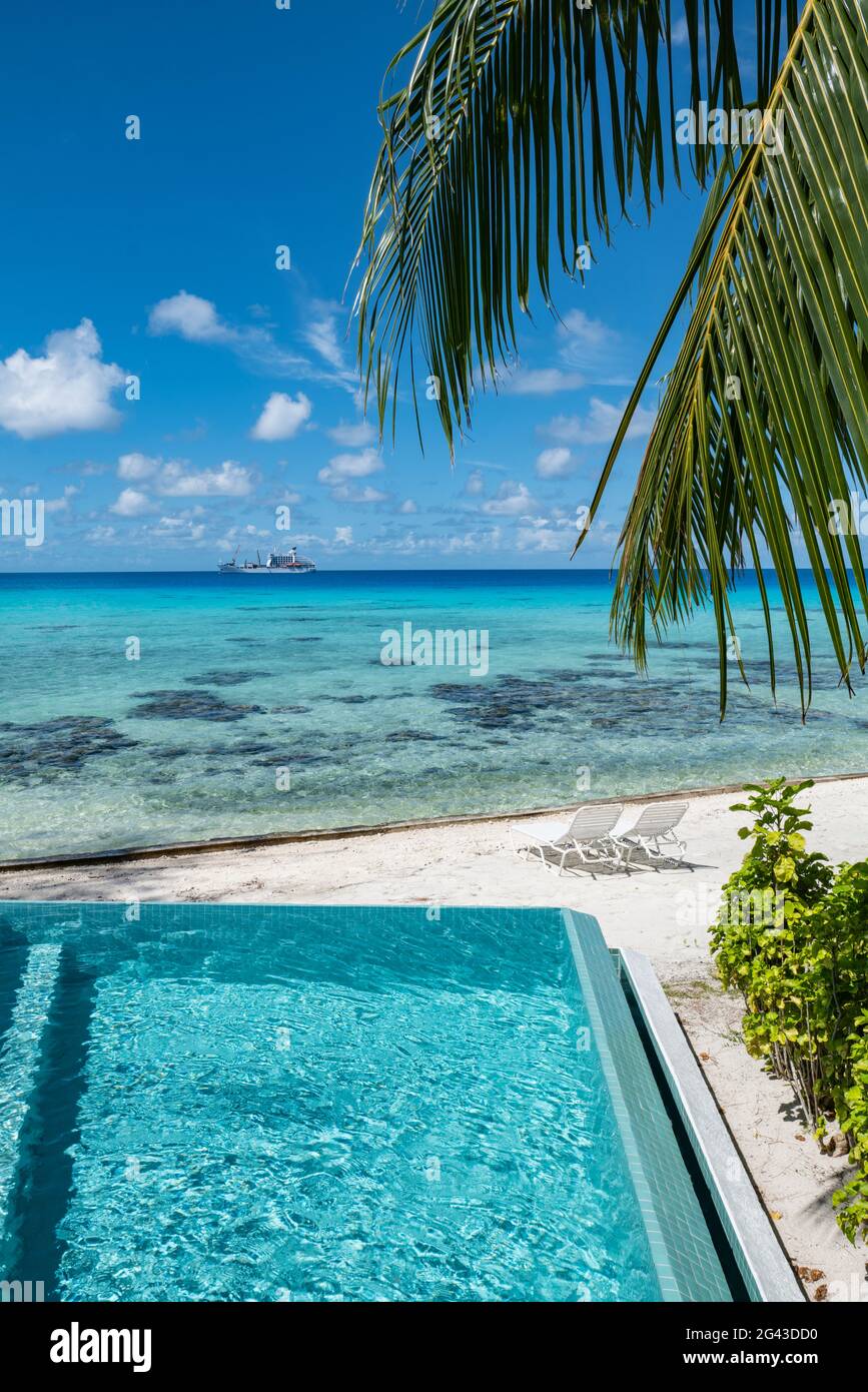 Private pool in front of a bungalow at the Kia Ora Resort hotel Stock ...