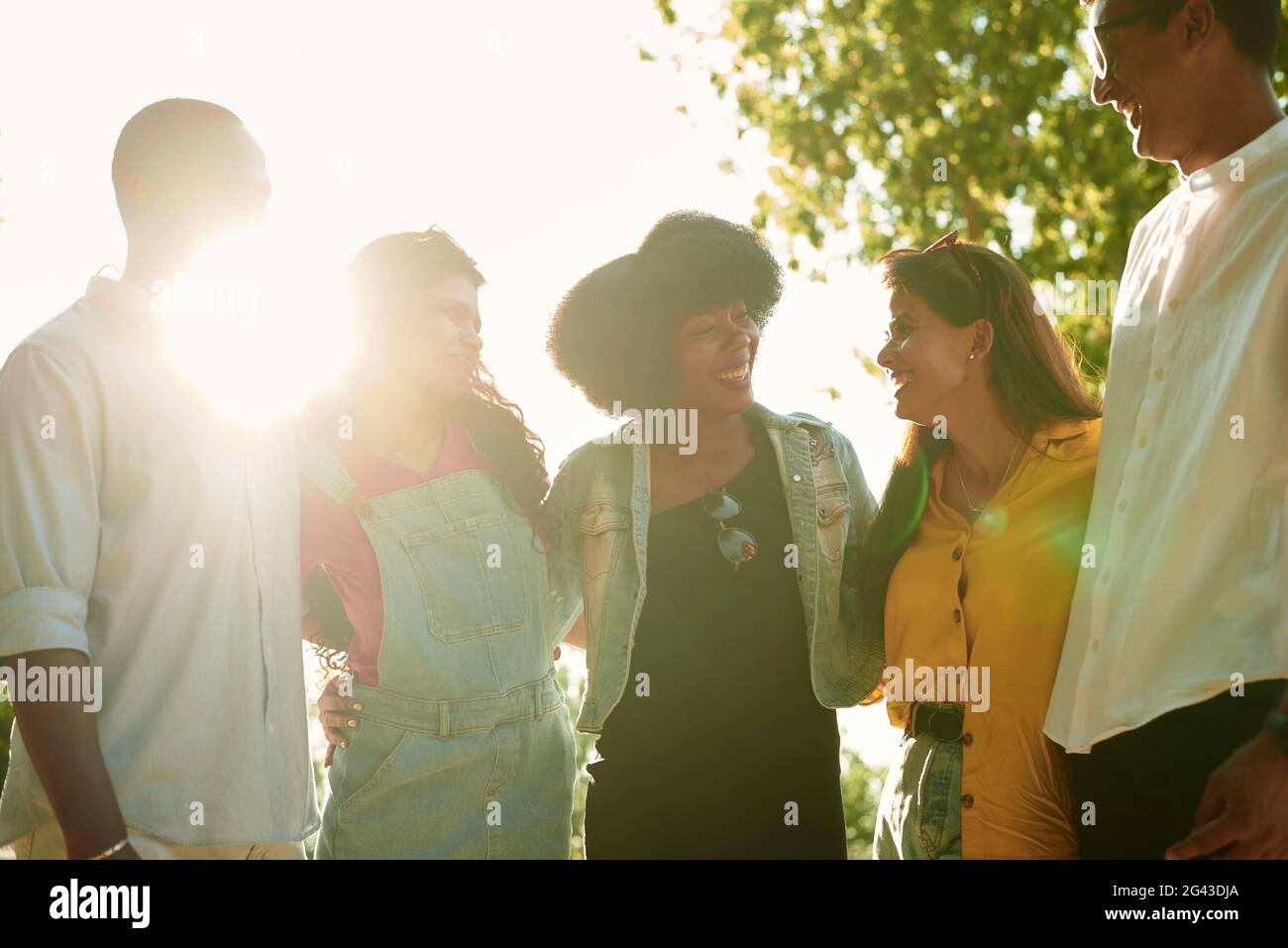 Group of happy friends having fun outdoor. Young diverse culture people ...