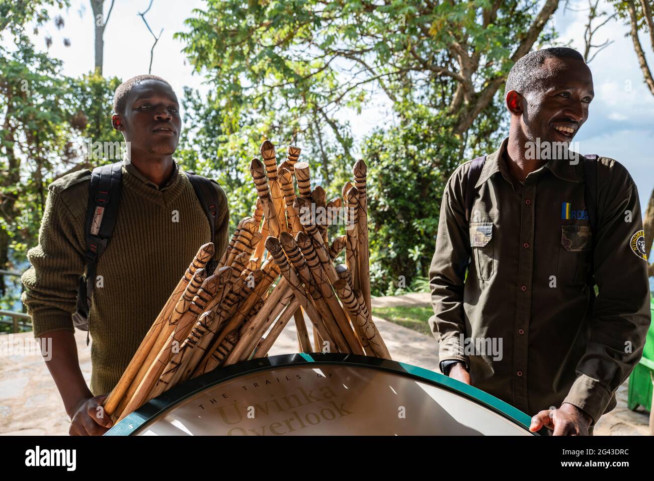Two ranger guides with walking sticks in preparation for a hike through ...
