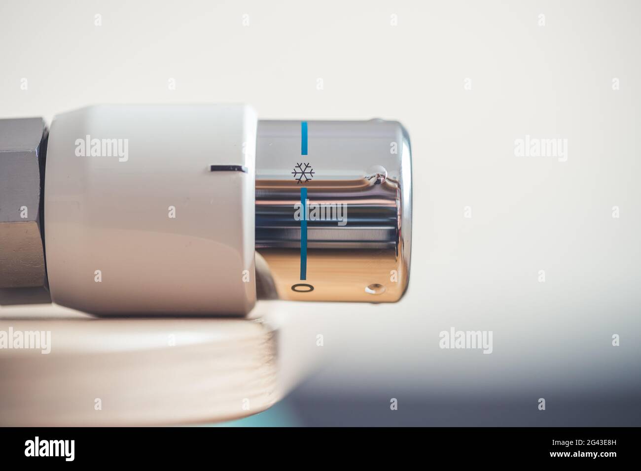 Heating costs: Heat regulator on a heater, close up picture. Set on off ...