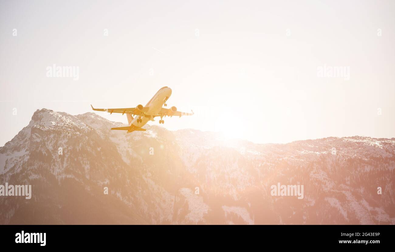 Airplane scenery: take off from airport, mountain range in the alps ...