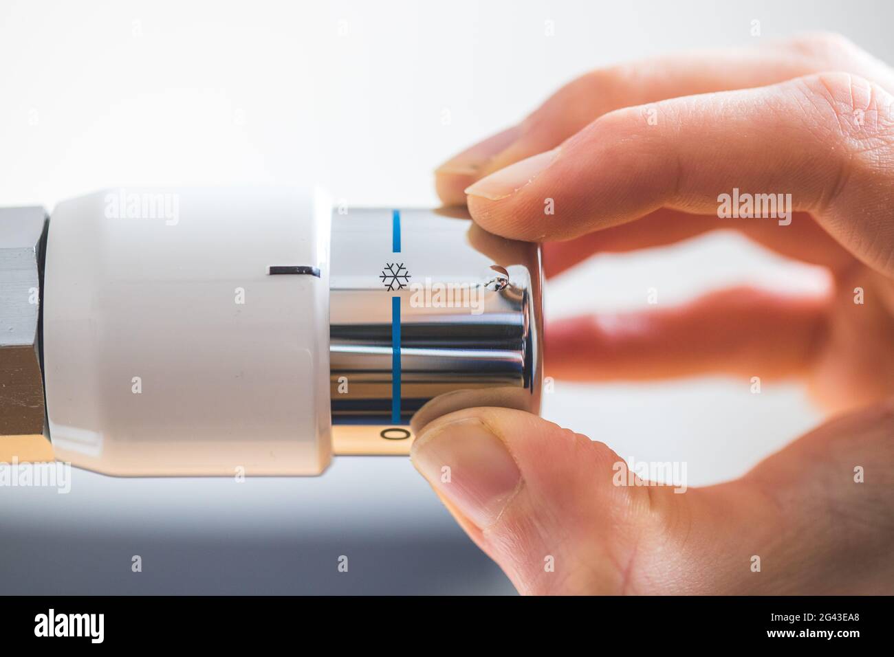 Heating costs: Heat regulator on a heater, close up picture. Set on off ...