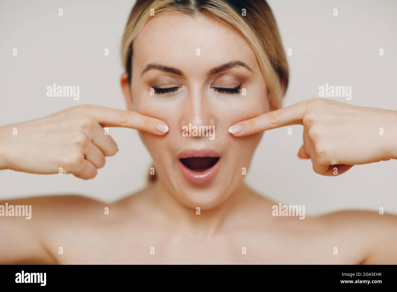 Young Adult Woman Doing Facial Gymnastics Self Massage And Rejuvenating