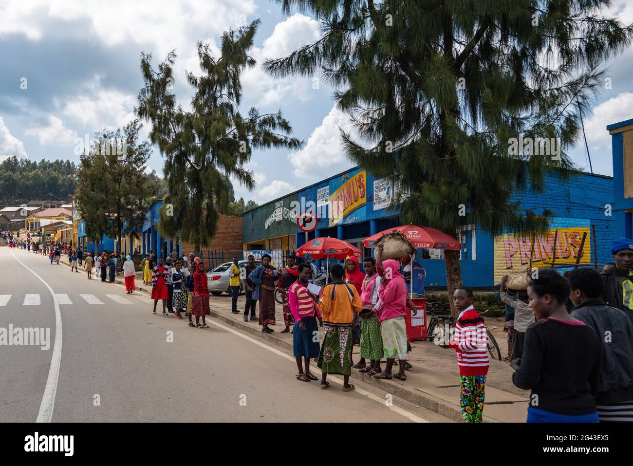 Street scene with many people wearing colorful clothes, near Mudasomwa ...