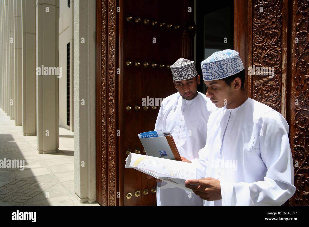Two students at the entrance of Sultan Qaboos University, Muscat, Oman ...