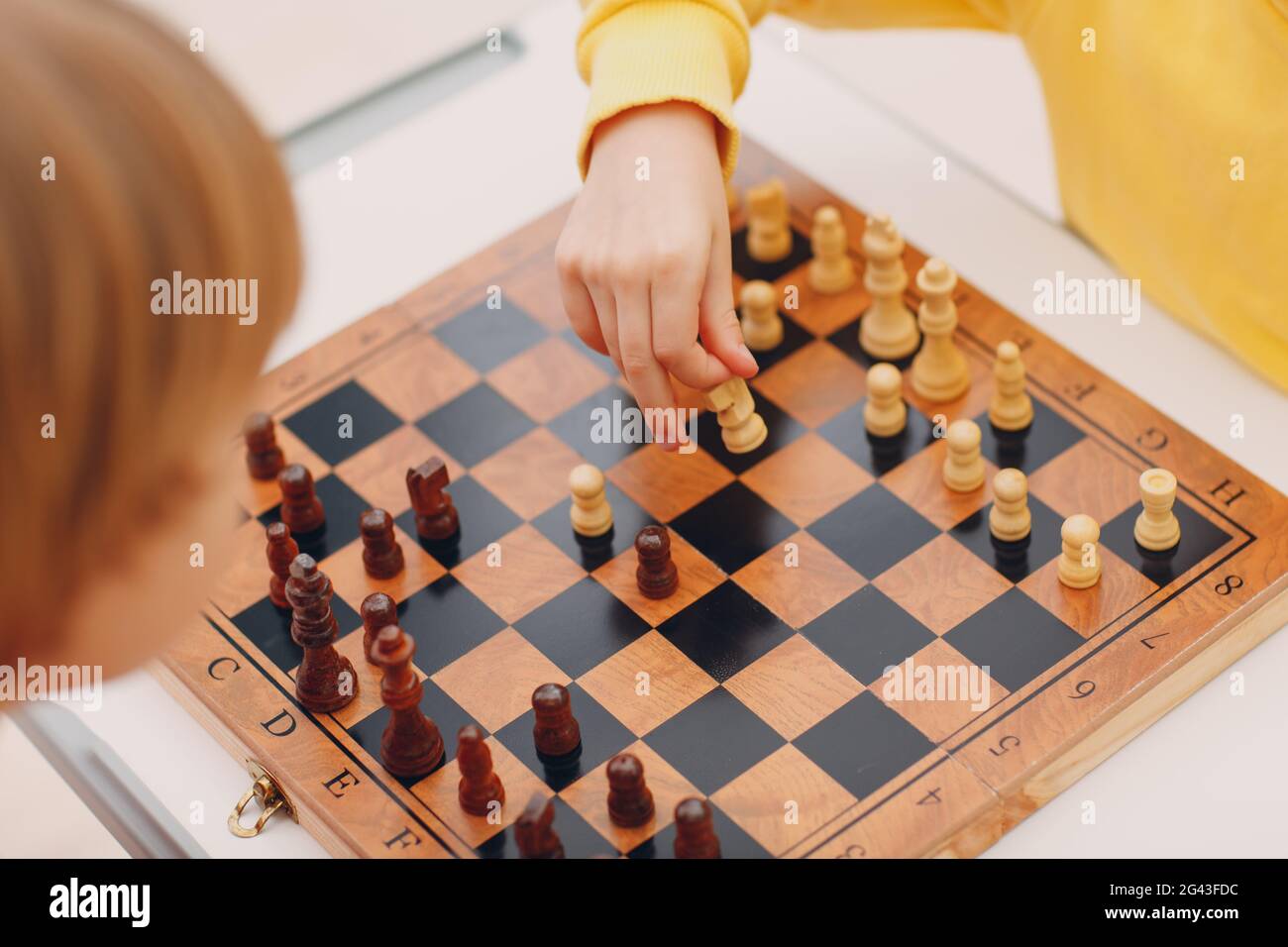Little kids playing chess at kindergarten or elementary school Stock ...