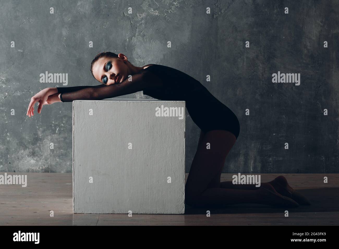 Young girl professional gymnast woman rhythmic gymnastics relaxing with ...