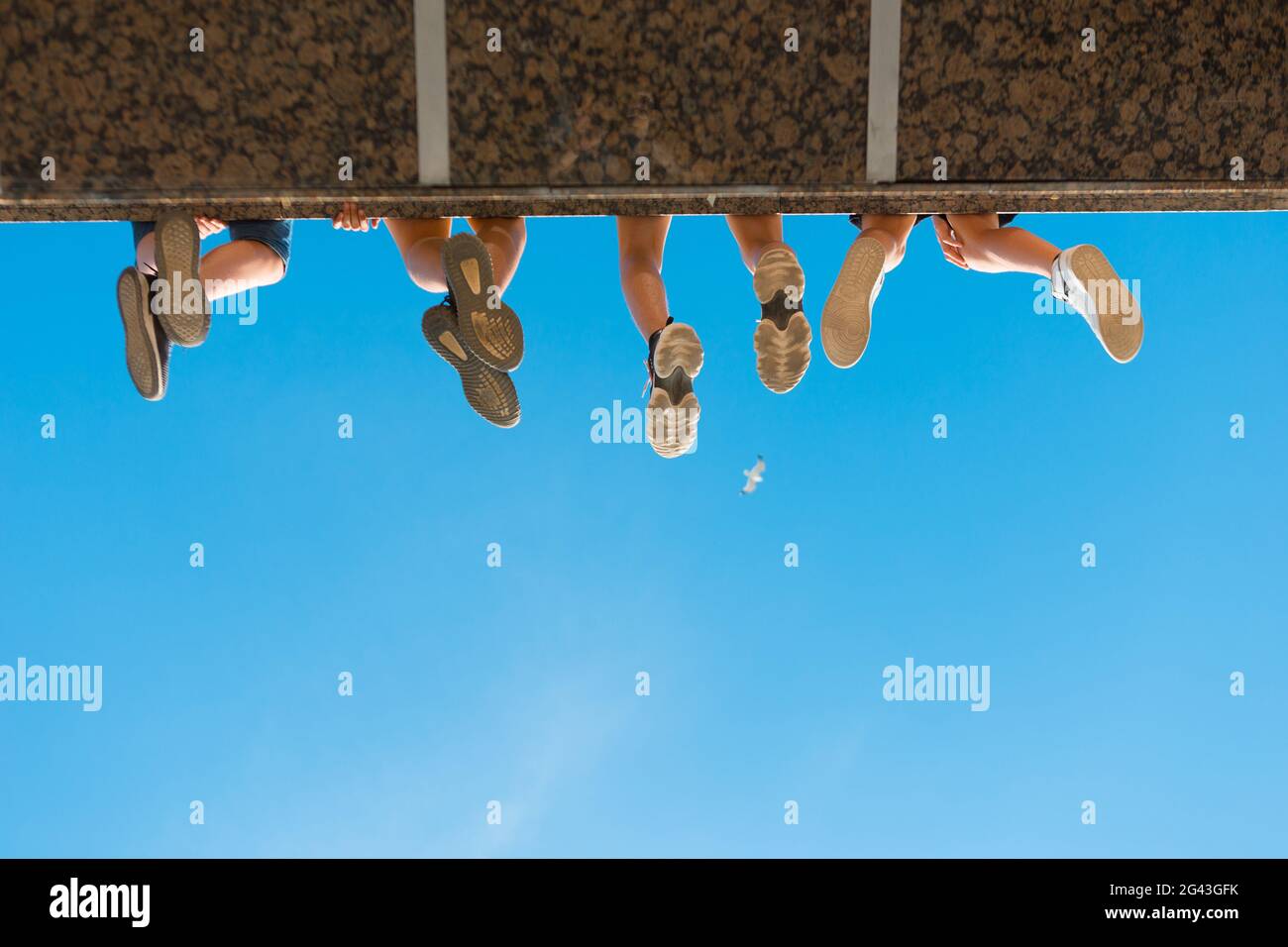 Man hanging from balcony hi-res stock photography and images - Alamy