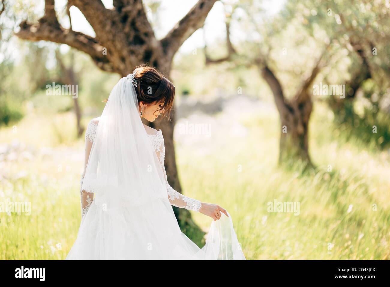 Attractive bride in long white hi-res stock photography and images - Alamy