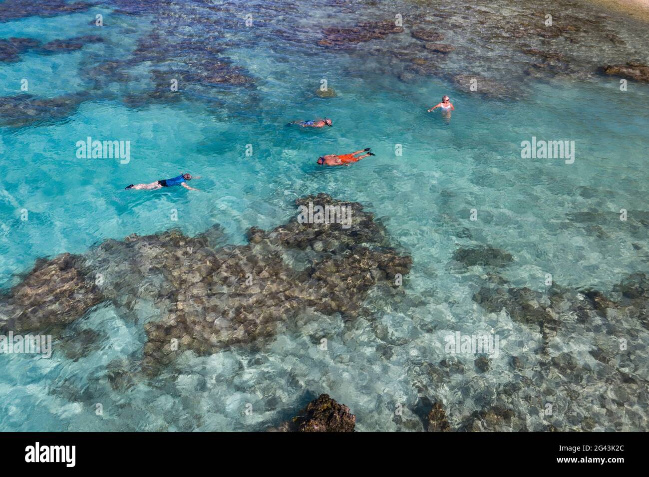 Aerial view of people snorkeling while snorkeling in the lagoon ...
