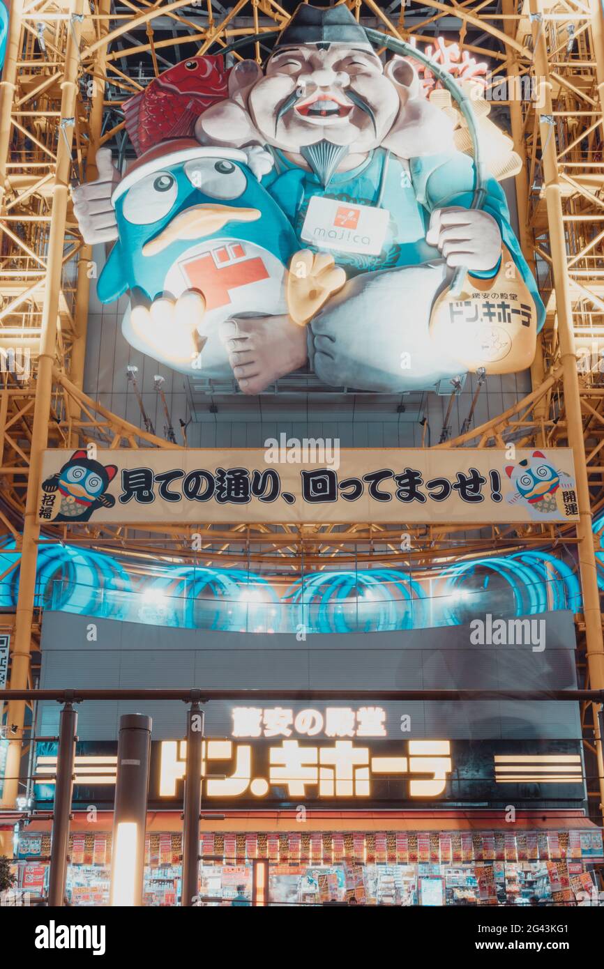 Elaborate neon sign in Osaka with the mascots of the Don Quixote ...