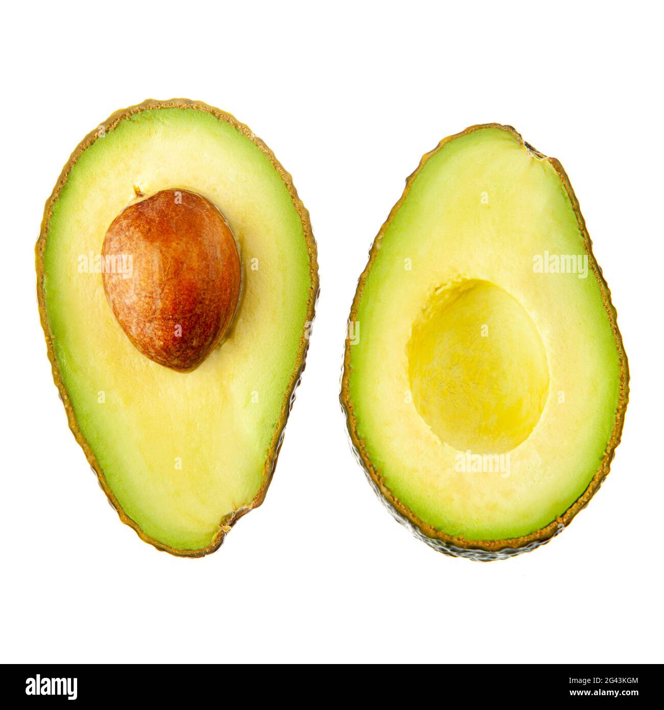 Cut in half avocado on a white background. Isolated Stock Photo - Alamy