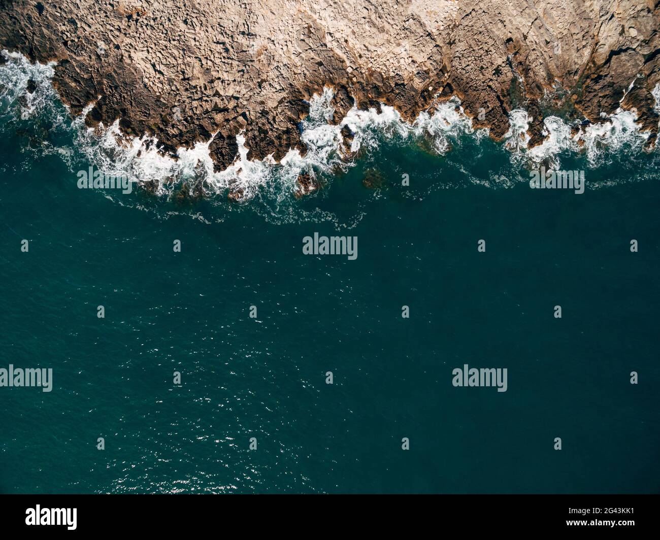 Aerial. Sea water and shore rocks texture background. Top view from ...
