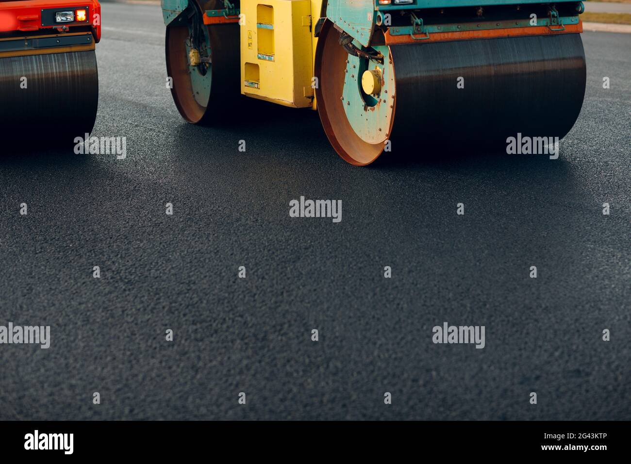 Asphalt paving. Paver machine. New road construction Stock Photo - Alamy