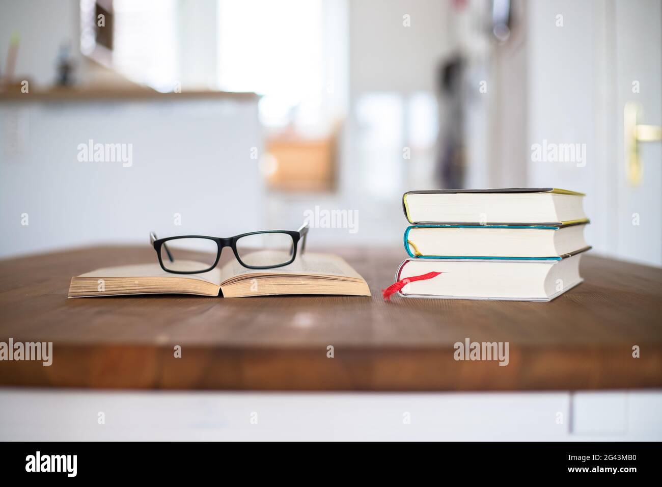 Knowledge and science concept: Stack of books and glasses lying on ...