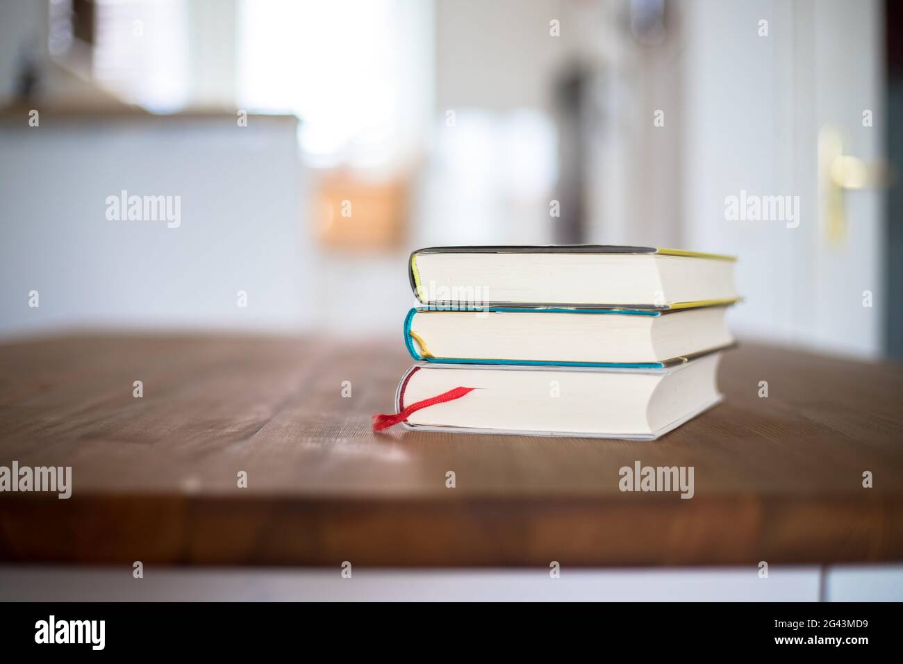 Knowledge and science concept: Stack of books lying on wooden desk ...