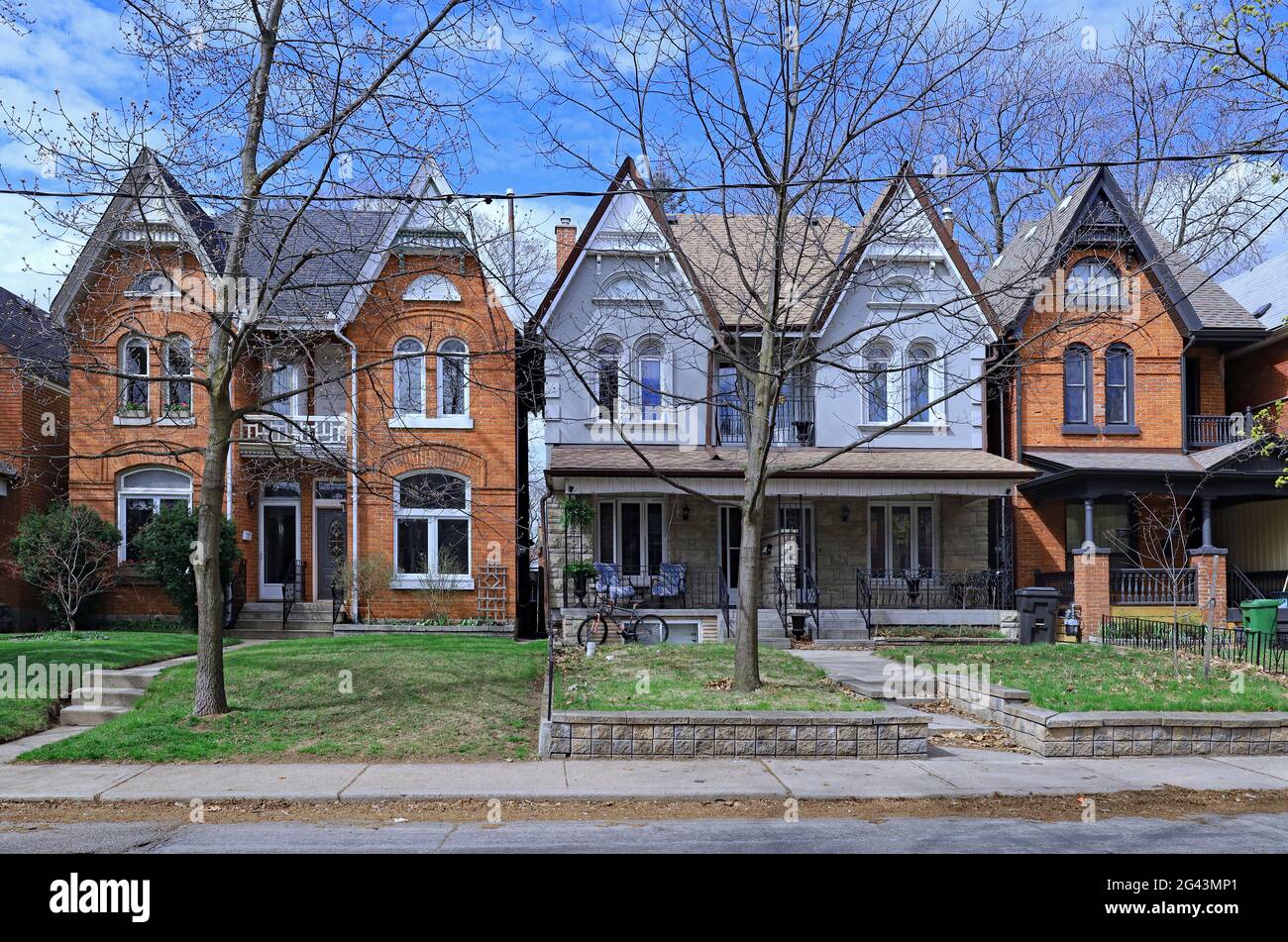 Residential street with tall narrow Victorian style semi-detached ...