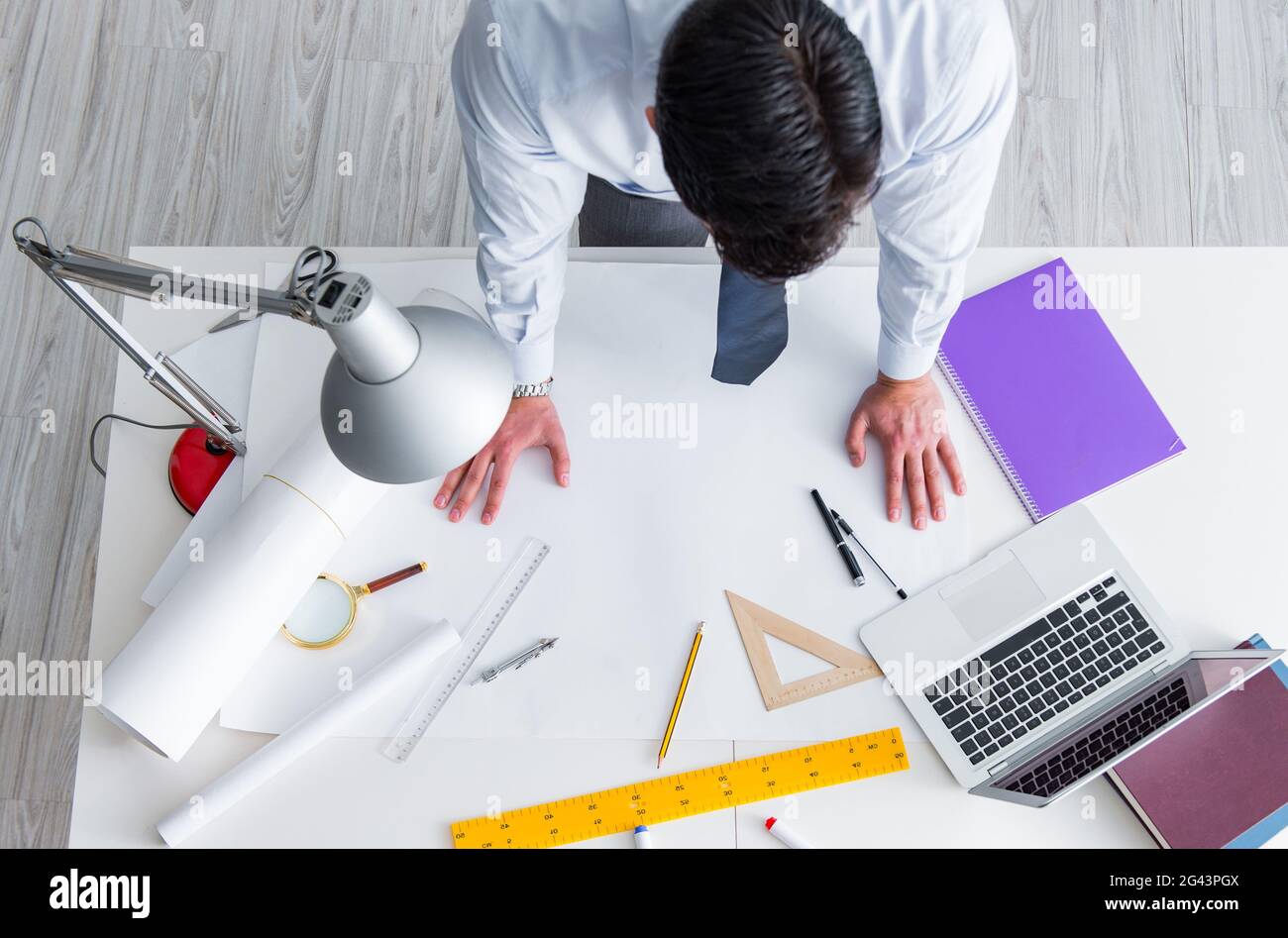Engineer working on new project drawings Stock Photo - Alamy