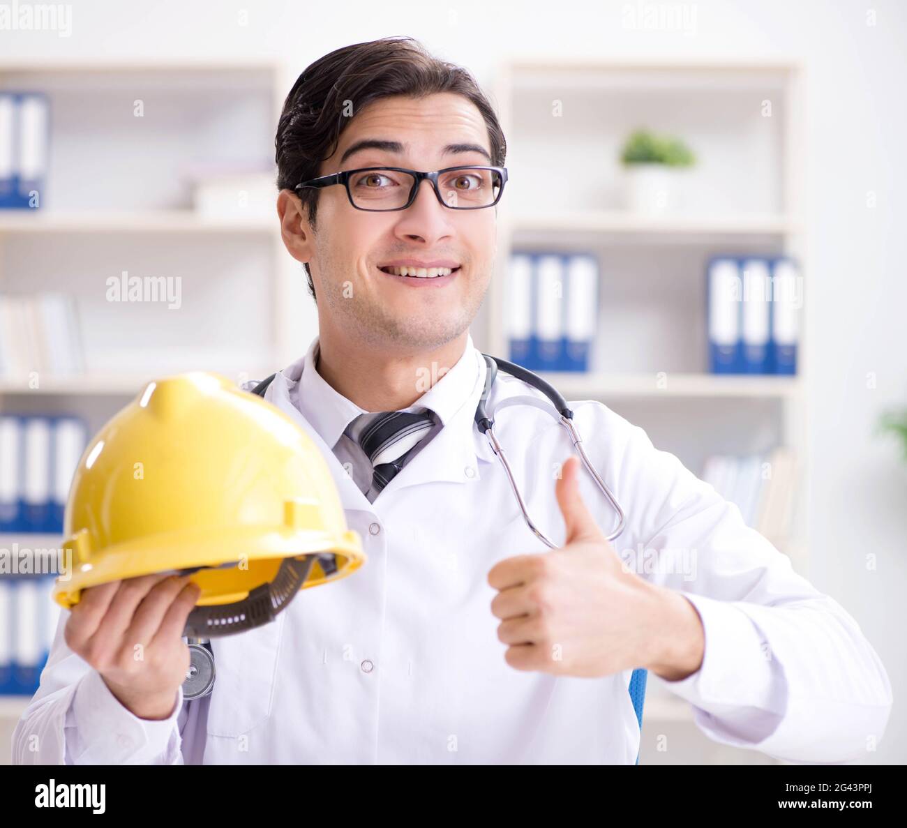 Safety doctor advising about wearing hard hat Stock Photo - Alamy