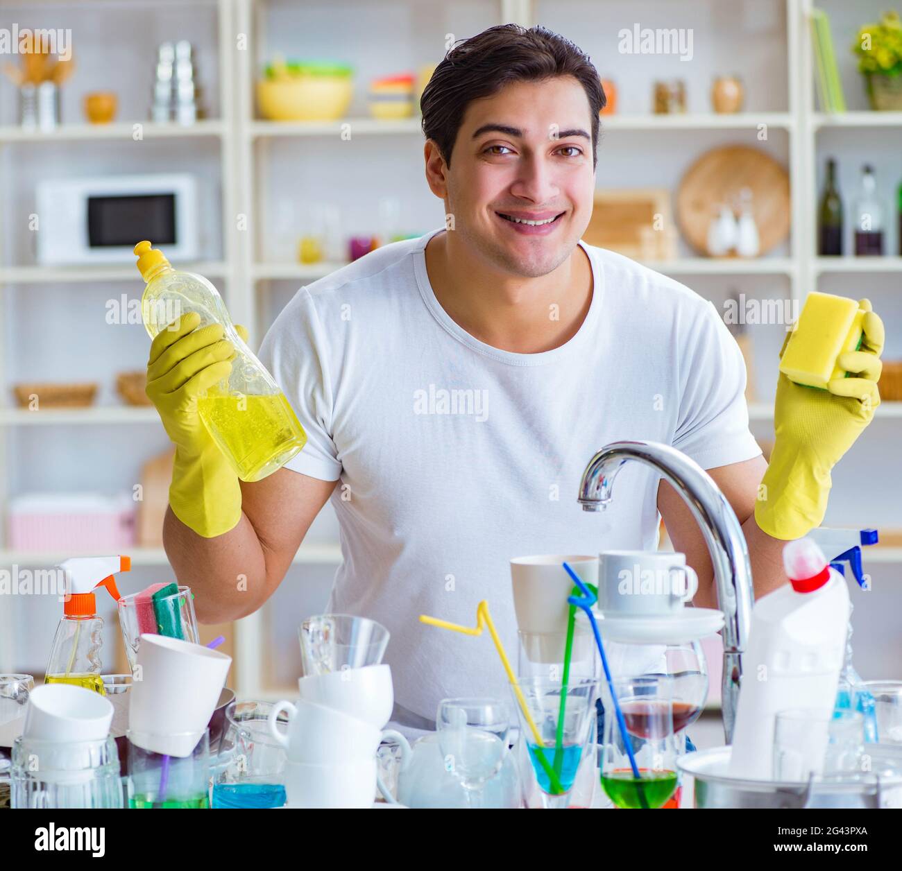 Man enjoying dish washing chores at home Stock Photo - Alamy