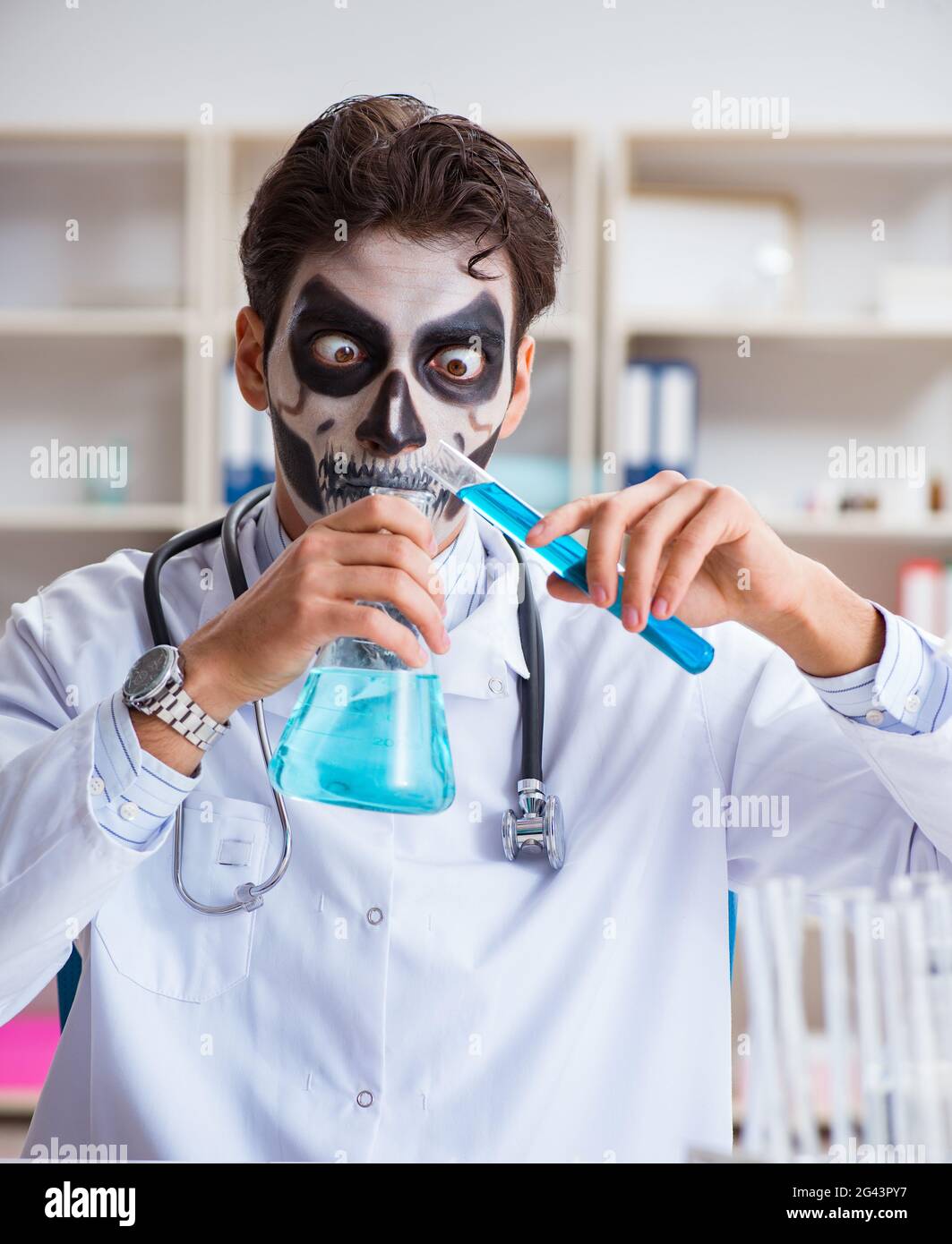 Scary monster doctor working in lab Stock Photo - Alamy