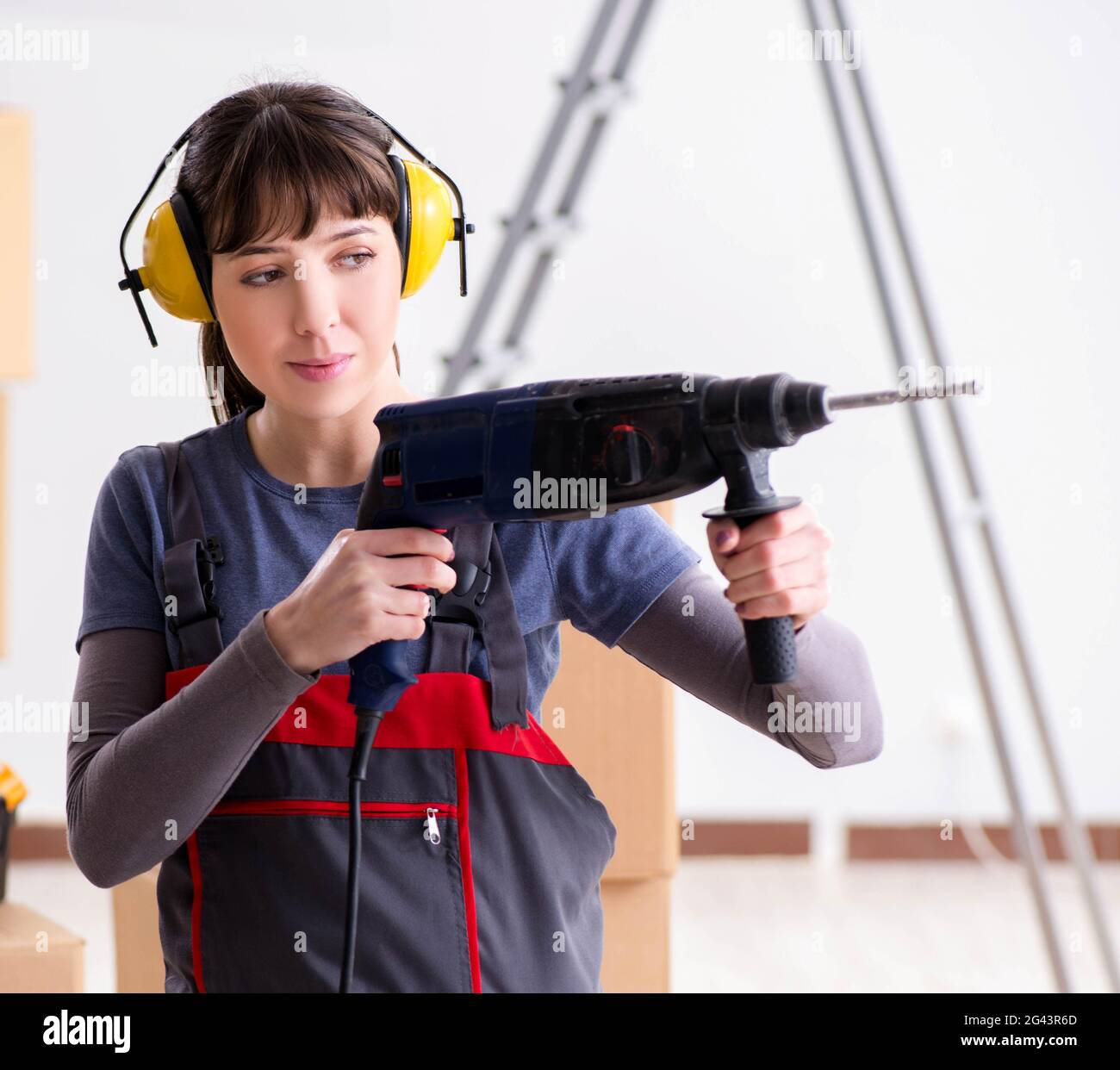 Woman toolbox at home drill hi-res stock photography and images - Alamy