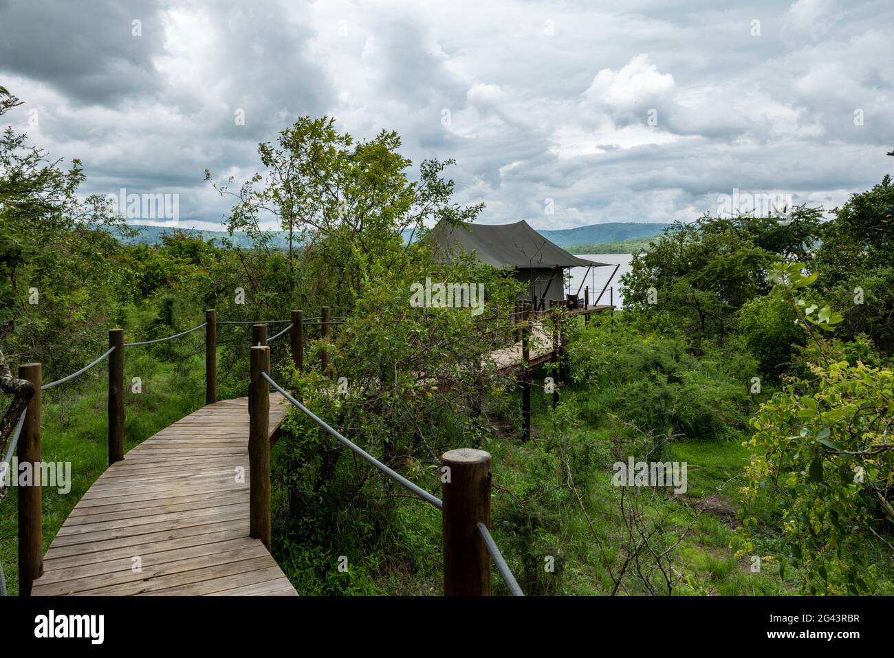 Wooden walkway leads to luxury tent accommodations at the luxury tented ...