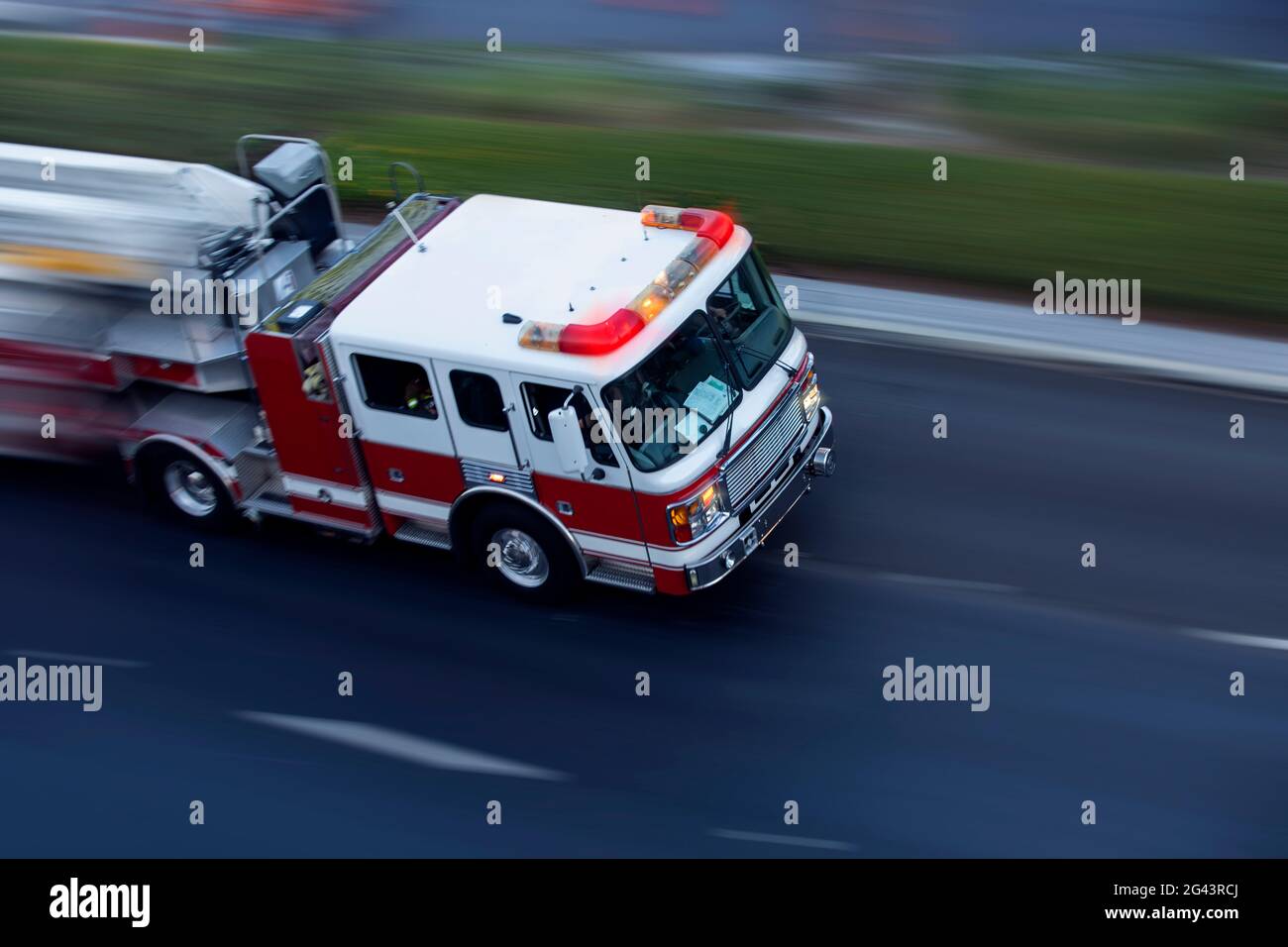 A fire engine responds to the scene of an emergency Stock Photo - Alamy
