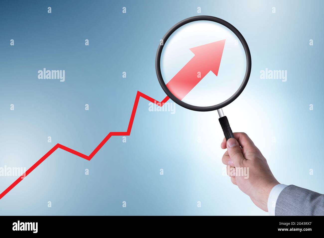 Concept of economic growth with chart and magnifying glass Stock Photo ...