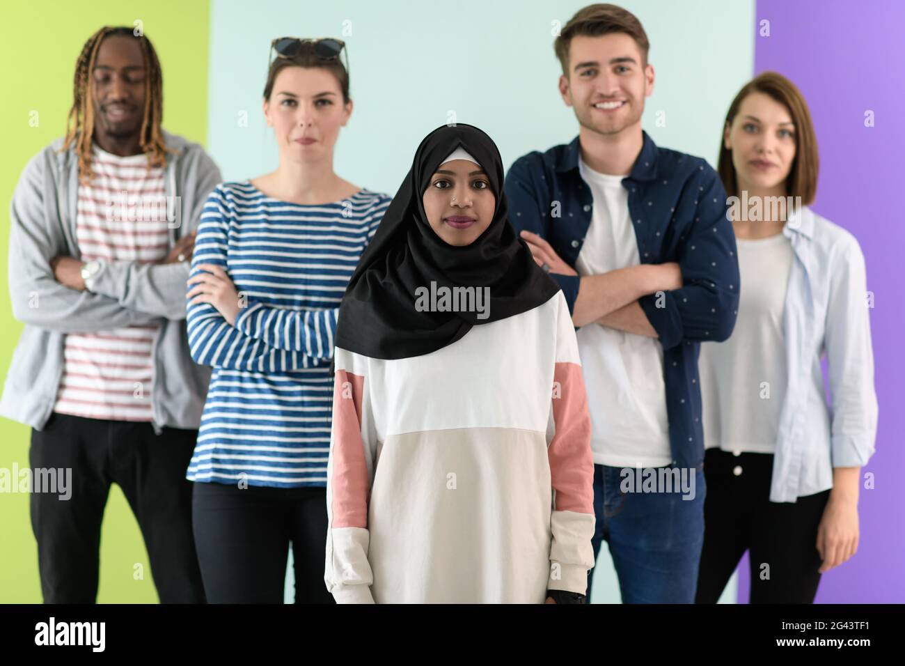 Group of diverse teenagers posing in a studio, determined teenagers in ...